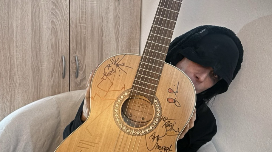 Enter Raffle to Win A Custom Acoustic Guitar From IAMX hosted by IAMX